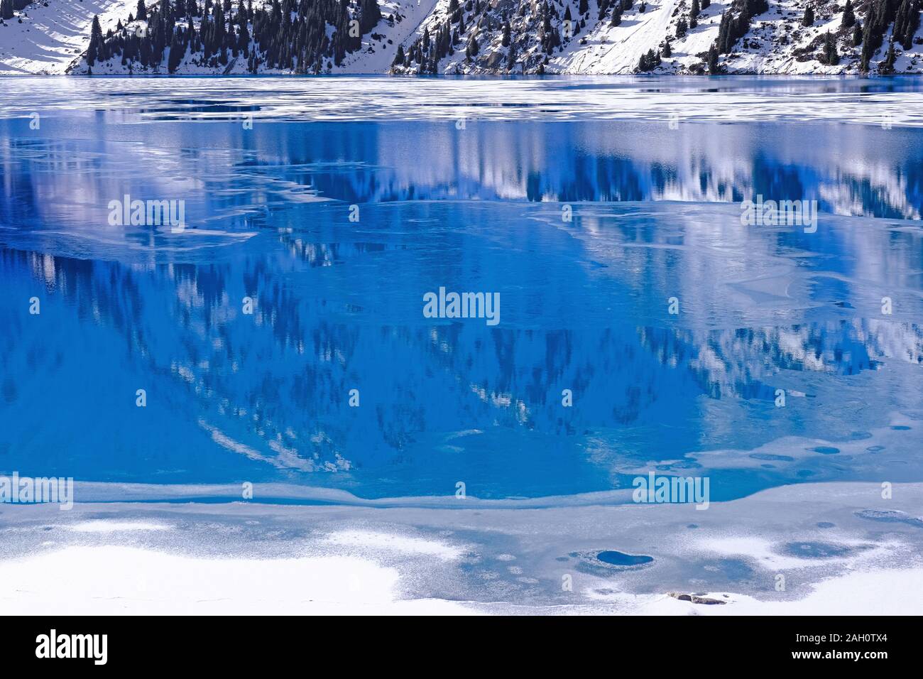 Bizarre forms of ice on a frozen mountain lake; variety of shapes in ...