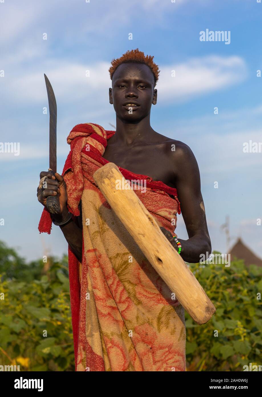 Portrait of a Mundari tribe man with hair dyed in orange with cow urine, Central Equatoria ...