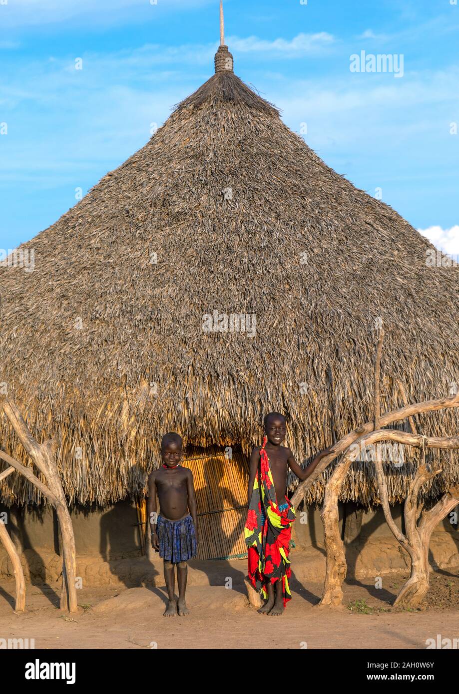Mundari tribe children in front of a traditional house, Central ...