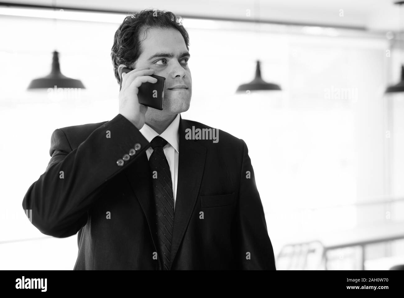 Business man smartphone home Black and White Stock Photos & Images - Alamy