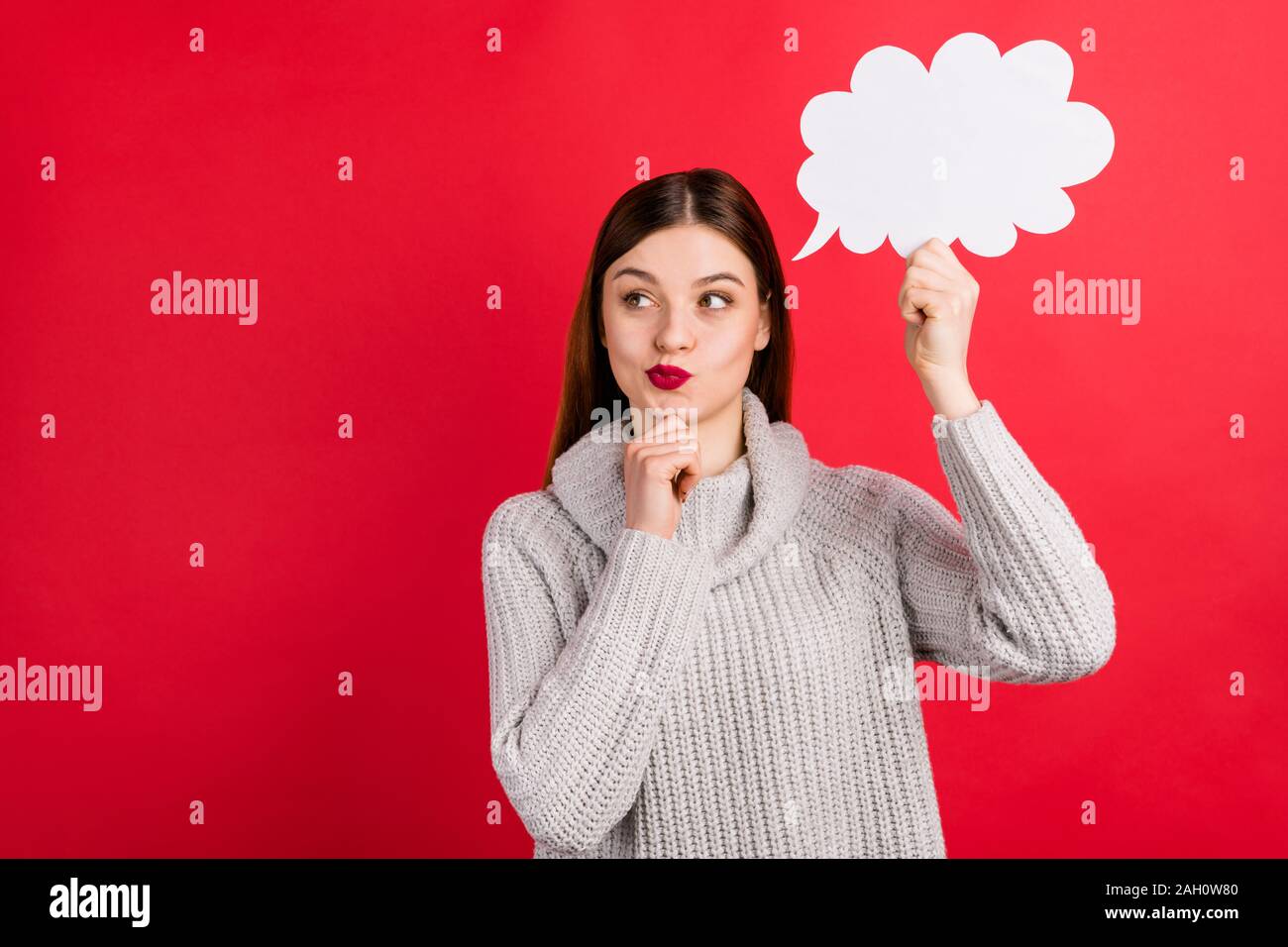 Funny lady with paper mind cloud in hand minded about dialogue answer ...