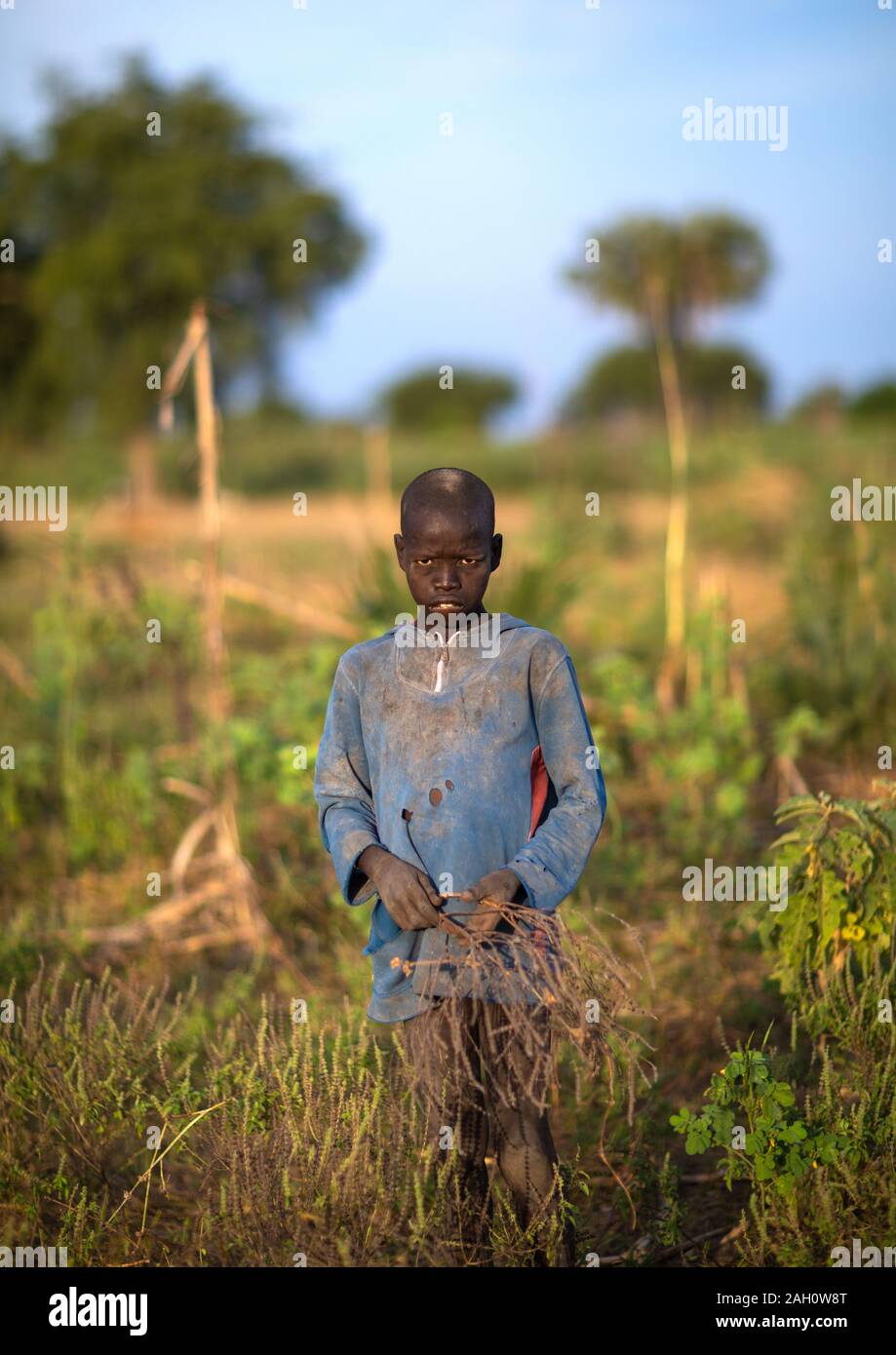 Portrait of a Mundari tribe boy in a field, Central Equatoria, Terekeka, South Sudan Stock Photo ...