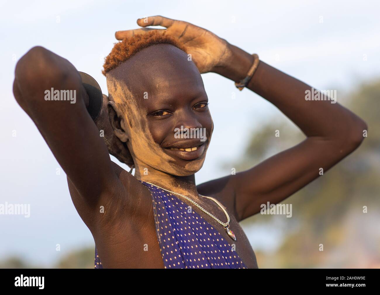 Mundari tribe boy covered in ash to protect from the mosquitoes and flies, Central Equatoria ...