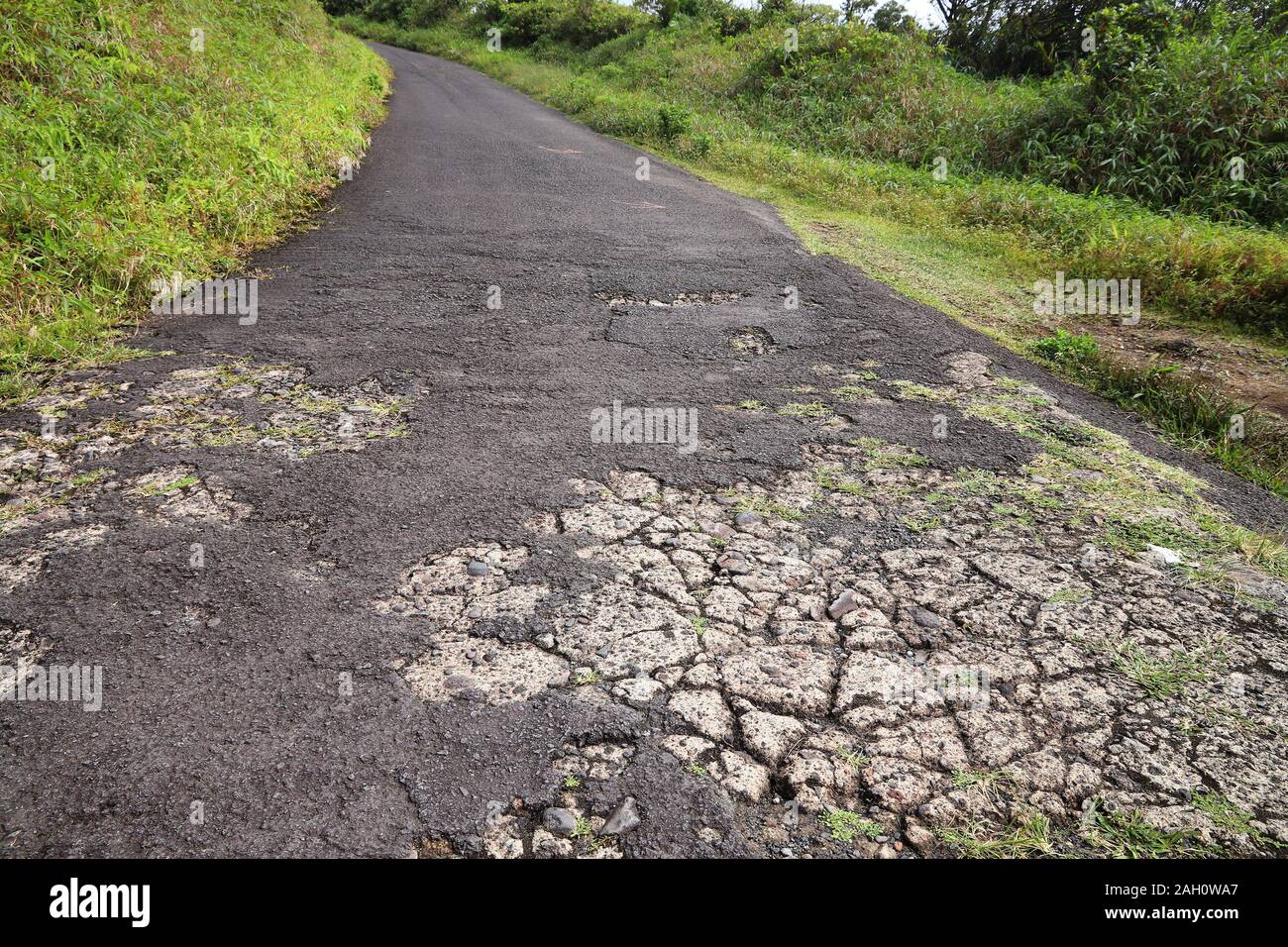 Pothole road in Guadeloupe. Countryside road maintenance concept Stock ...