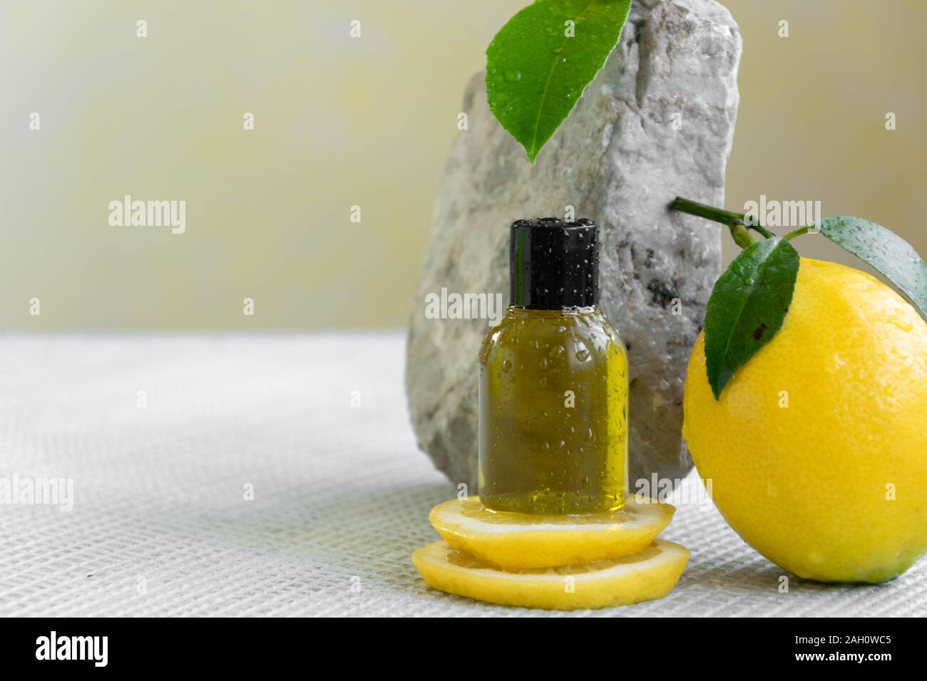 Bottles with essential lemon oil. Healthy natural beauty treatment ...