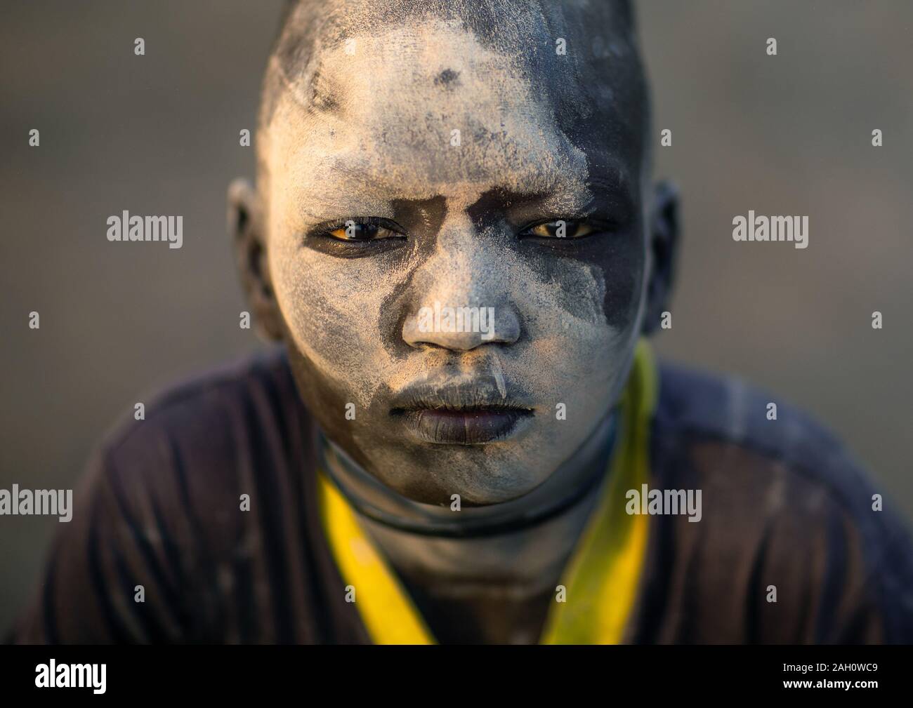 Mundari tribe boy covered in ash to protect from the mosquitoes and flies, Central Equatoria ...