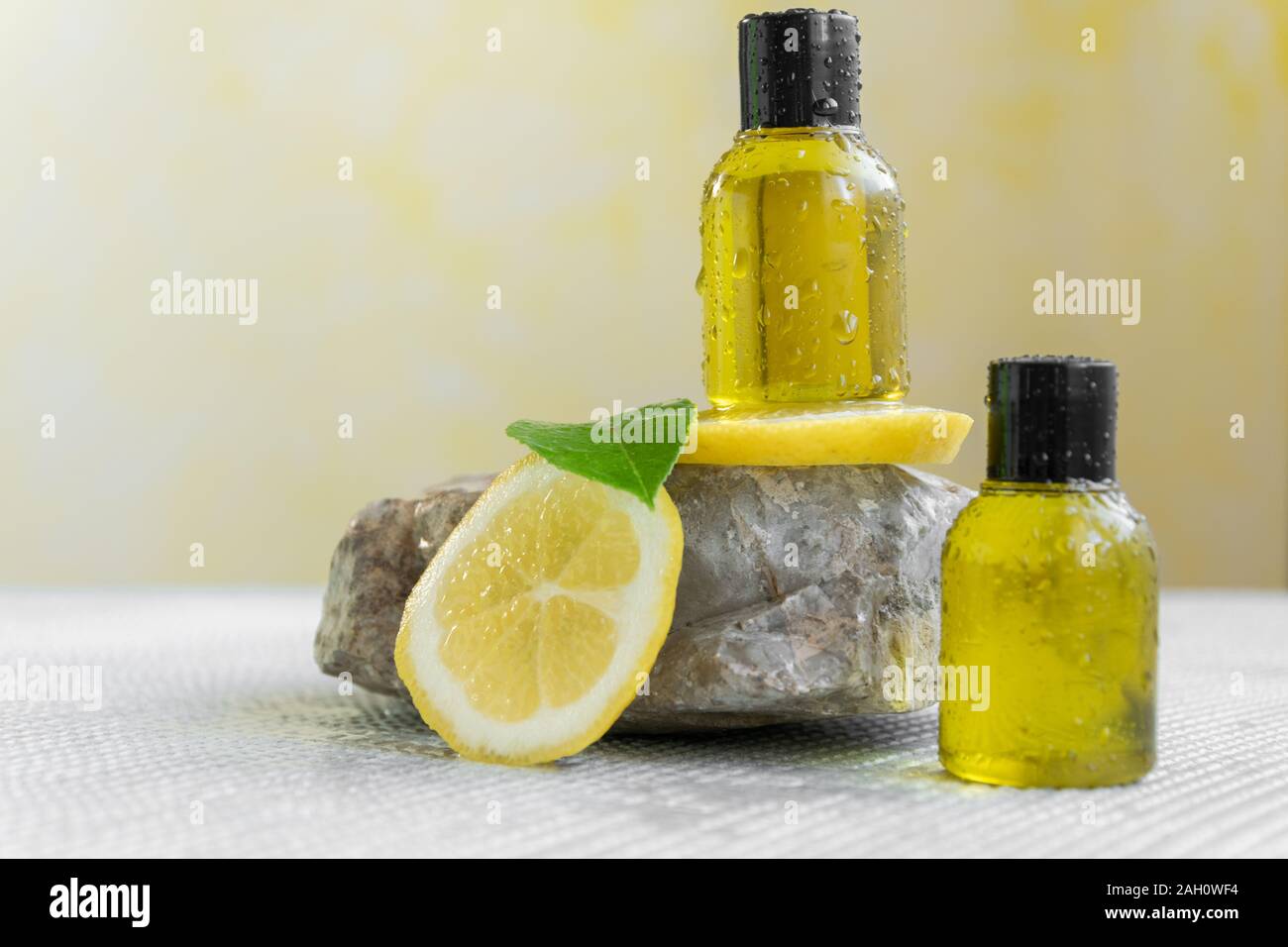 Bottles with essential lemon oil. Healthy natural beauty treatment ...