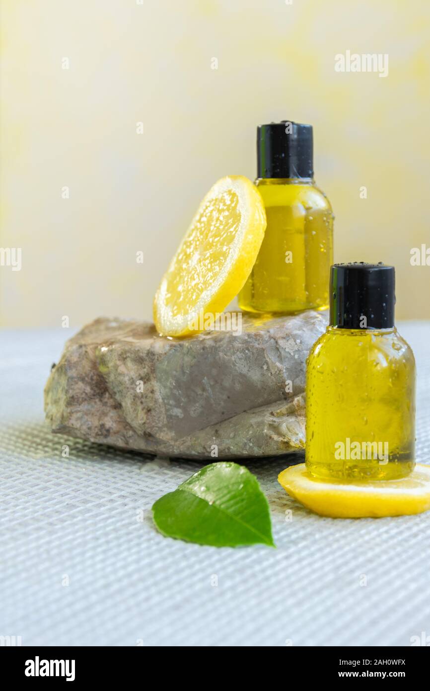 Bottles with essential lemon oil. Healthy natural beauty treatment ...