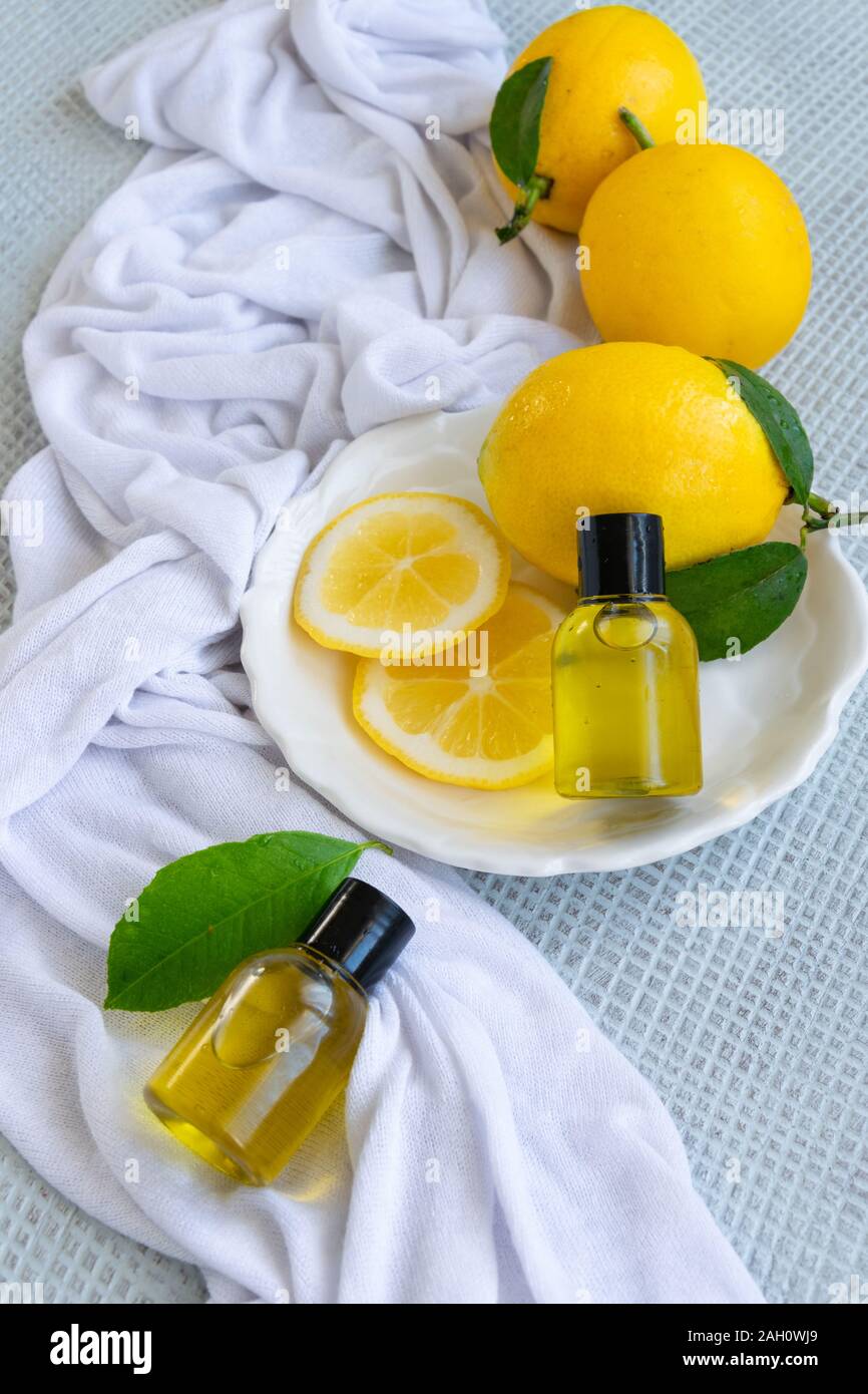 Bottles with essential lemon oil. Healthy natural beauty treatment ...