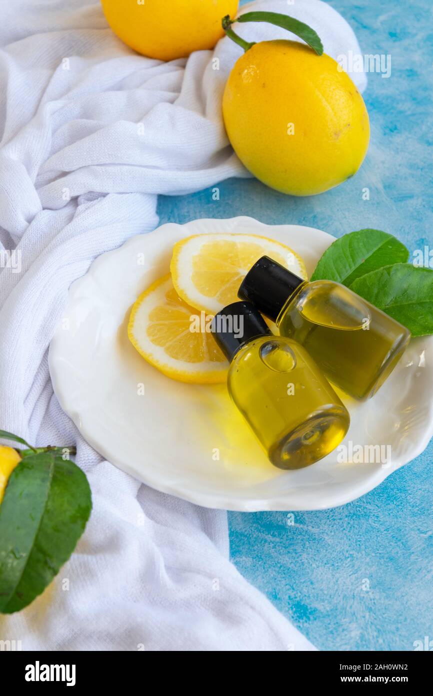 Bottles with essential lemon oil. Healthy natural beauty treatment ...