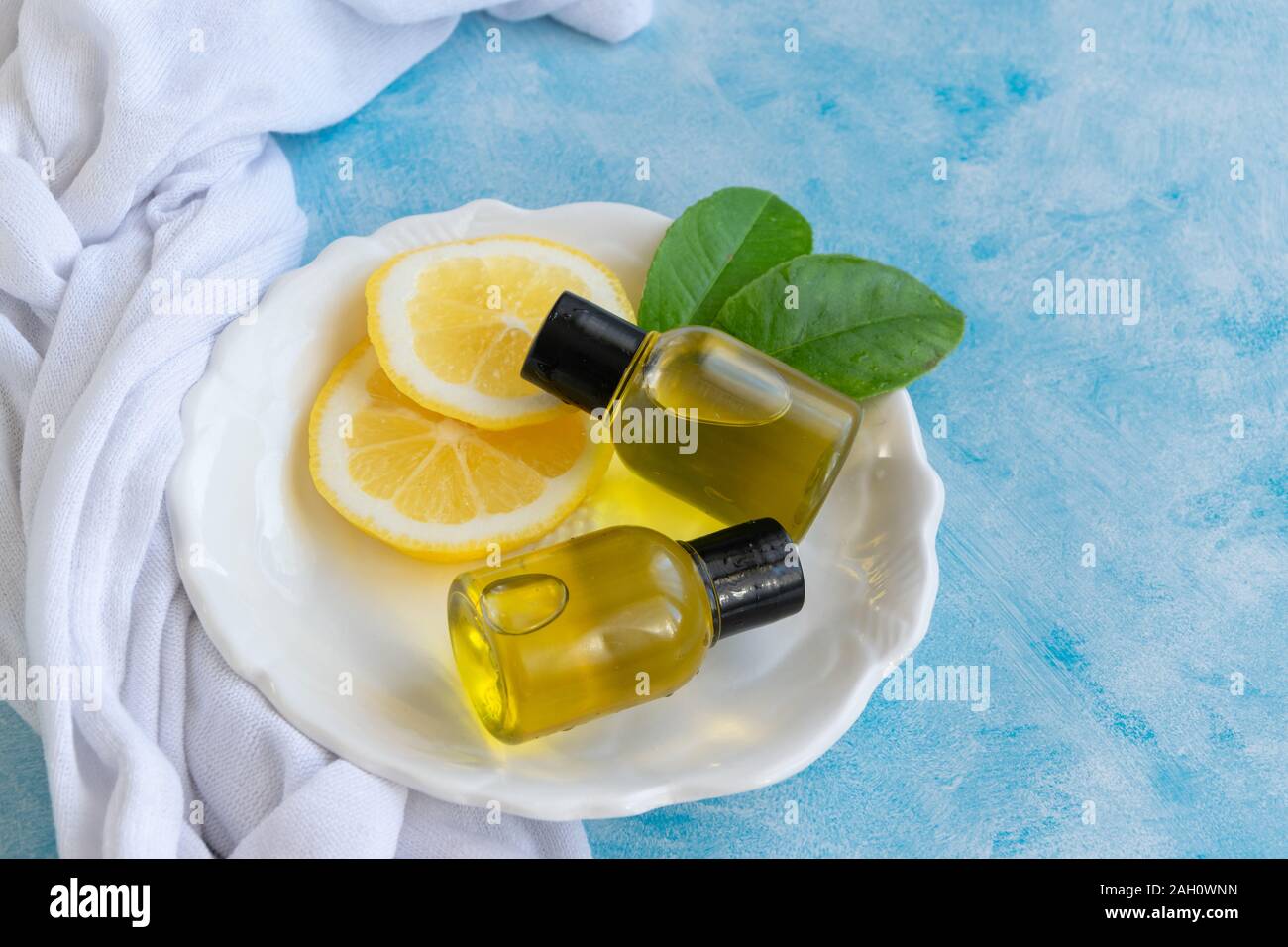Bottles with essential lemon oil. Healthy natural beauty treatment ...