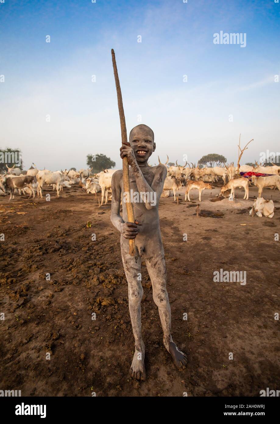 Mundari tribe boy taking care of the long horns cows in the camp, Central Equatoria, Terekeka ...