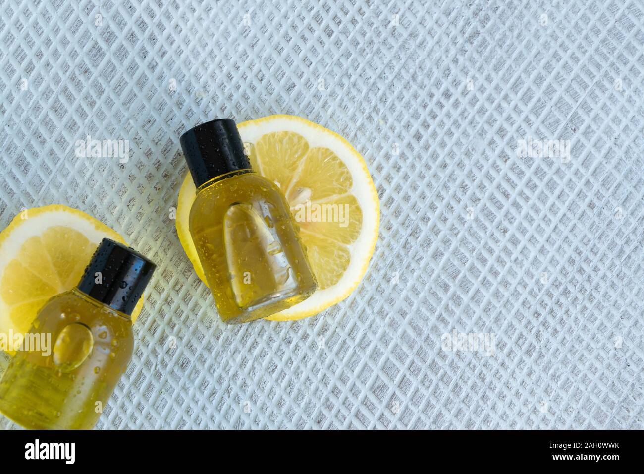 Bottles with essential lemon oil. Healthy natural beauty treatment ...