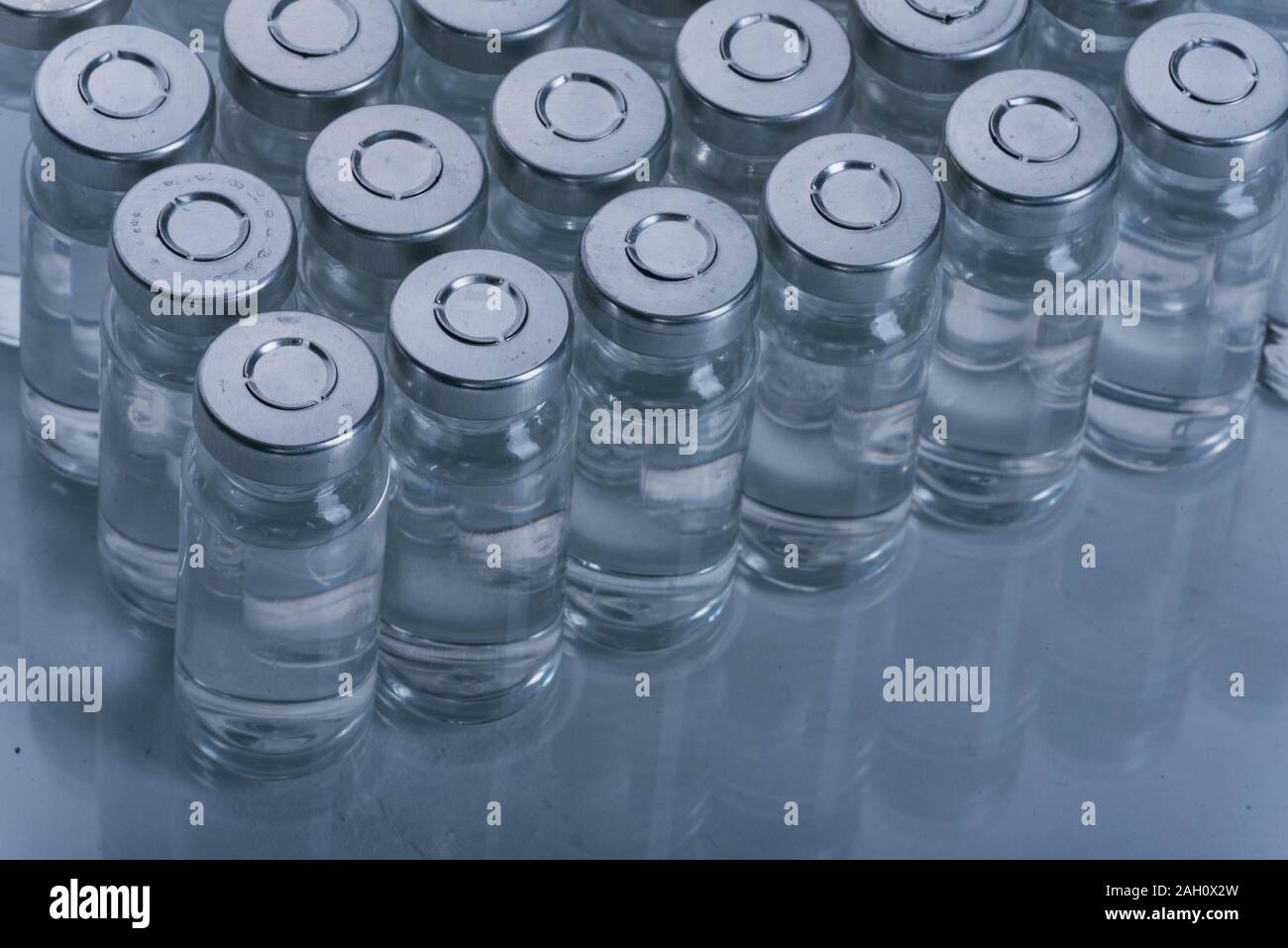 Glass medical ampoule vial for injection. Medicine is dry white drug ...