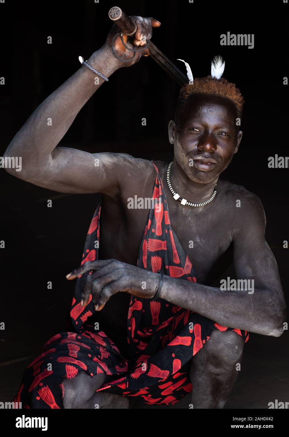 Portrait of a Mundari tribe man with hair dyed in orange with cow urine, Central Equatoria ...