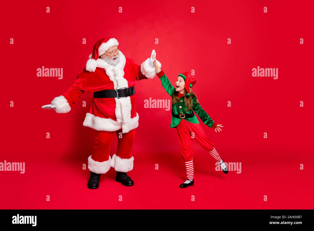 Full length profile side photo of excited santa claus elf celebrate ...