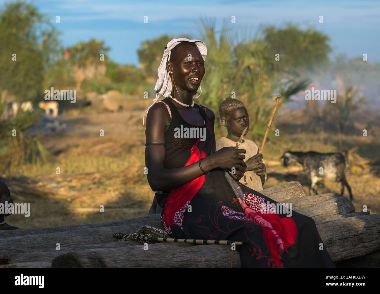 Portrait of a Mundari tribe woman sit on a bed, Central Equatoria, Terekeka, South Sudan Stock ...