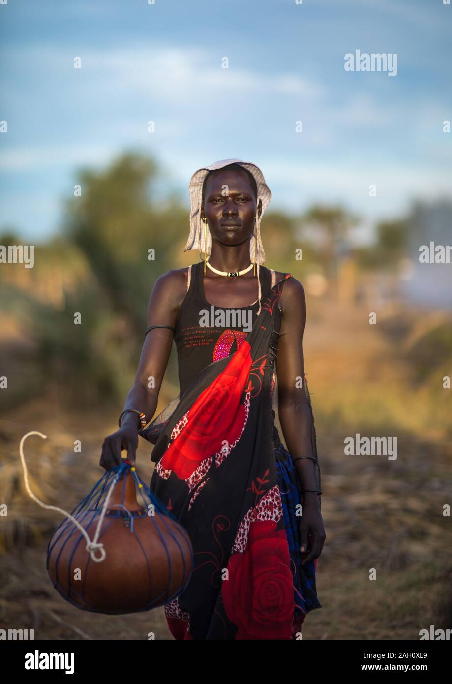 Portrait of a Mundari tribe woman with a calabash, Central Equatoria, Terekeka, South Sudan ...