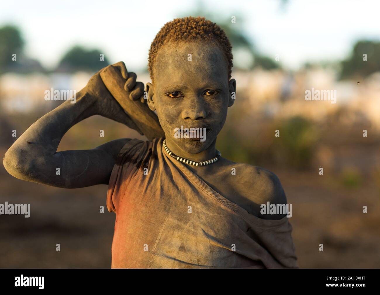 Mundari tribe boy covered in ash to protect from the mosquitoes and flies, Central Equatoria ...