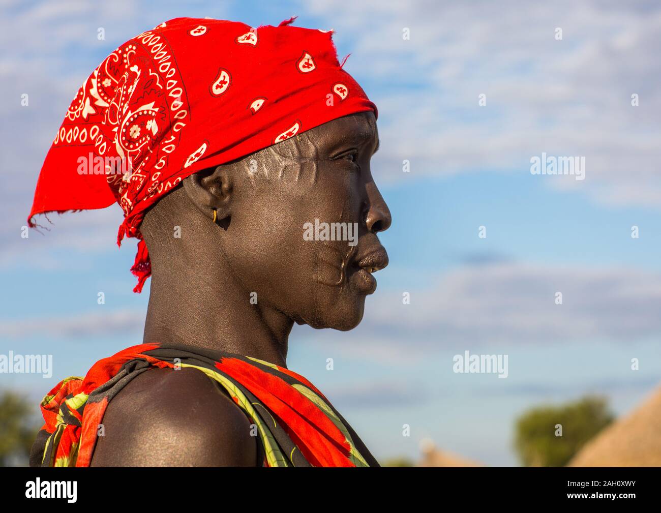 Portrait of a Mundari tribe woman with scarifications on the forehead ...