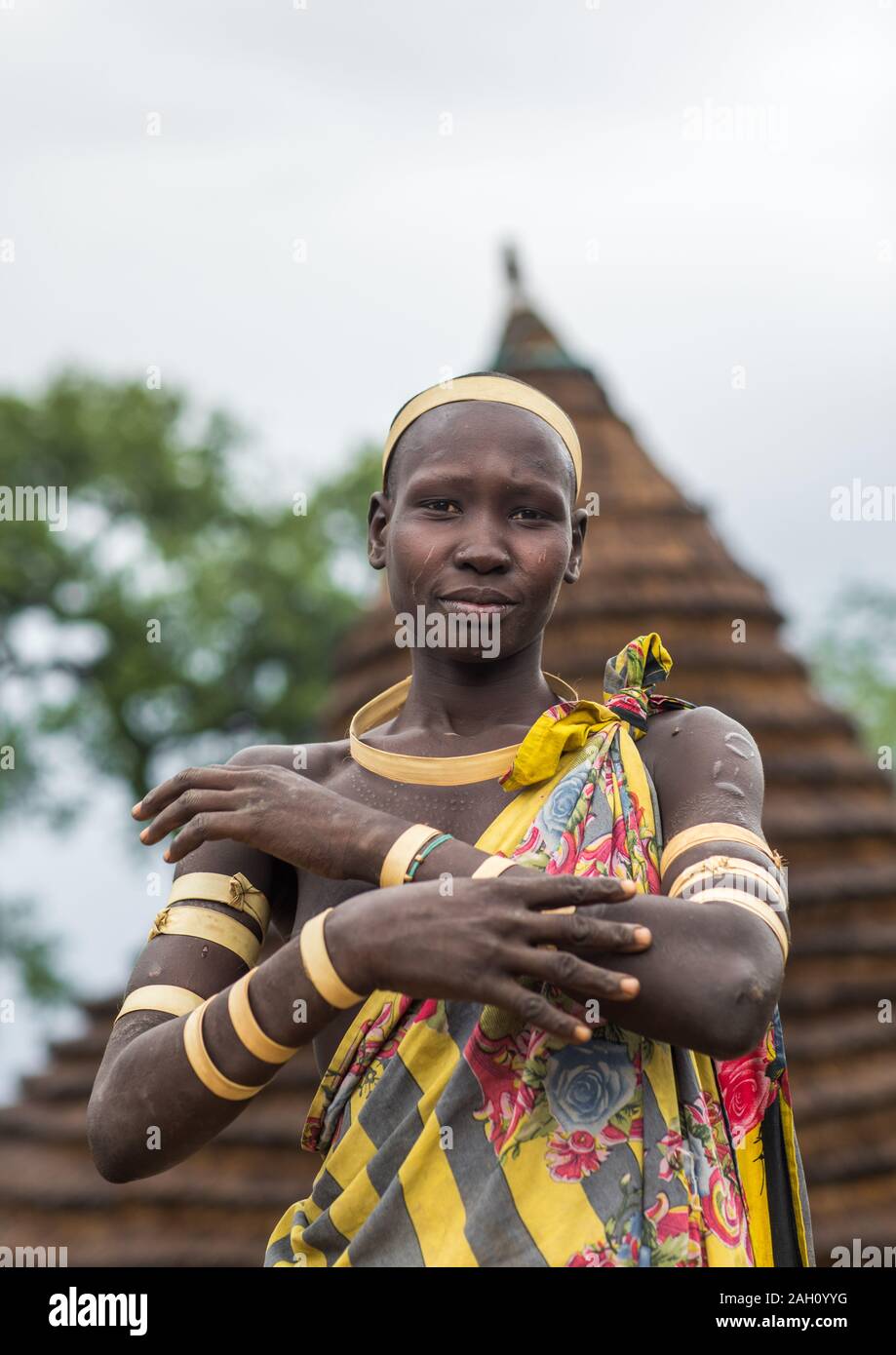 Portrait of a Larim tribe woman wearing bark bracelets as a sign of ...