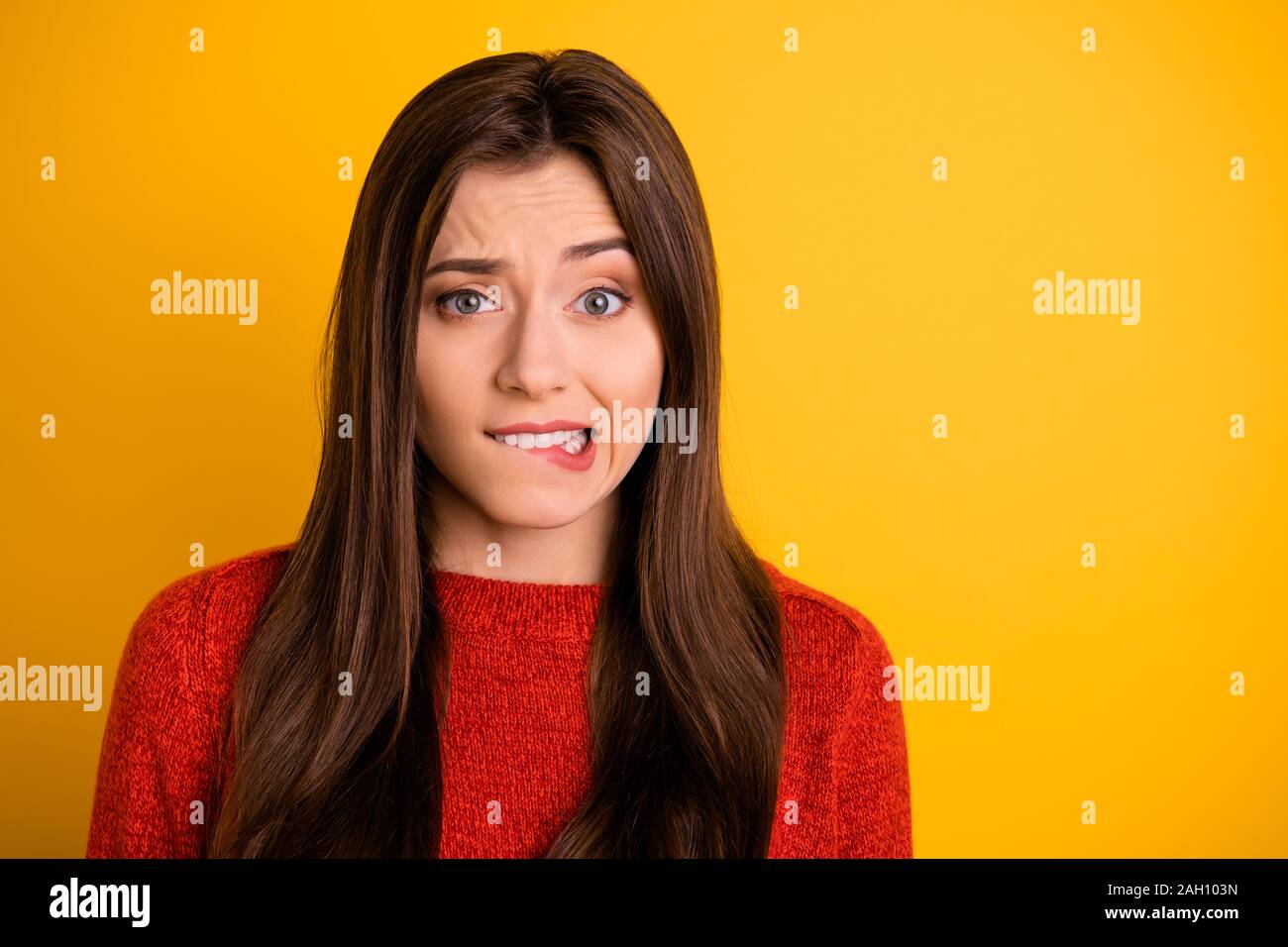 Portrait of disappointed scared girl bite her lips have trouble worry ...