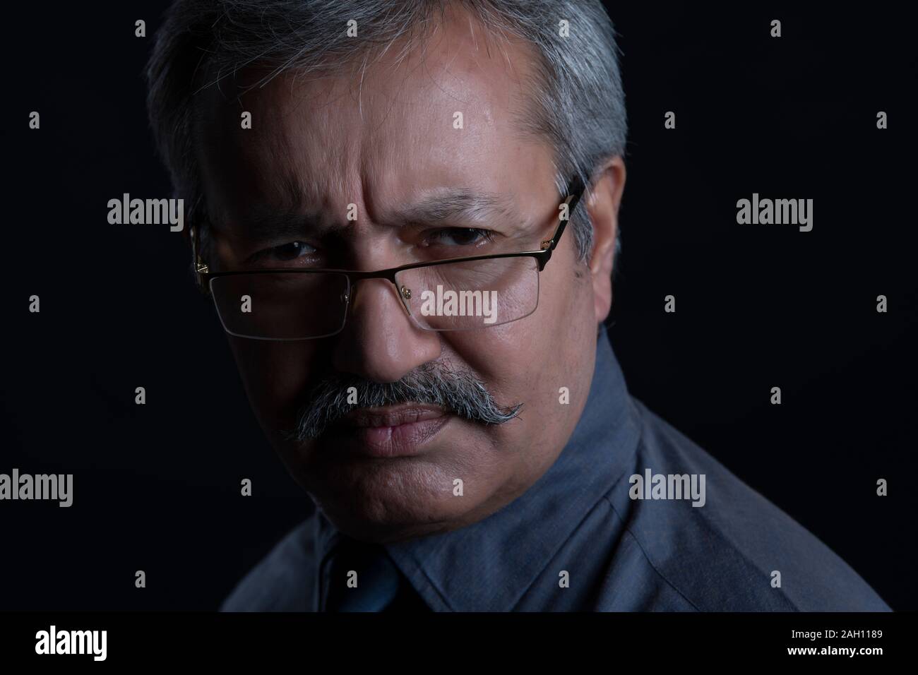 Portrait of an angry senior man Stock Photo - Alamy