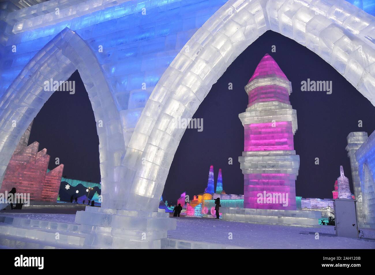 Visitors view ice sculptures on display during the 21st Harbin Ice and ...