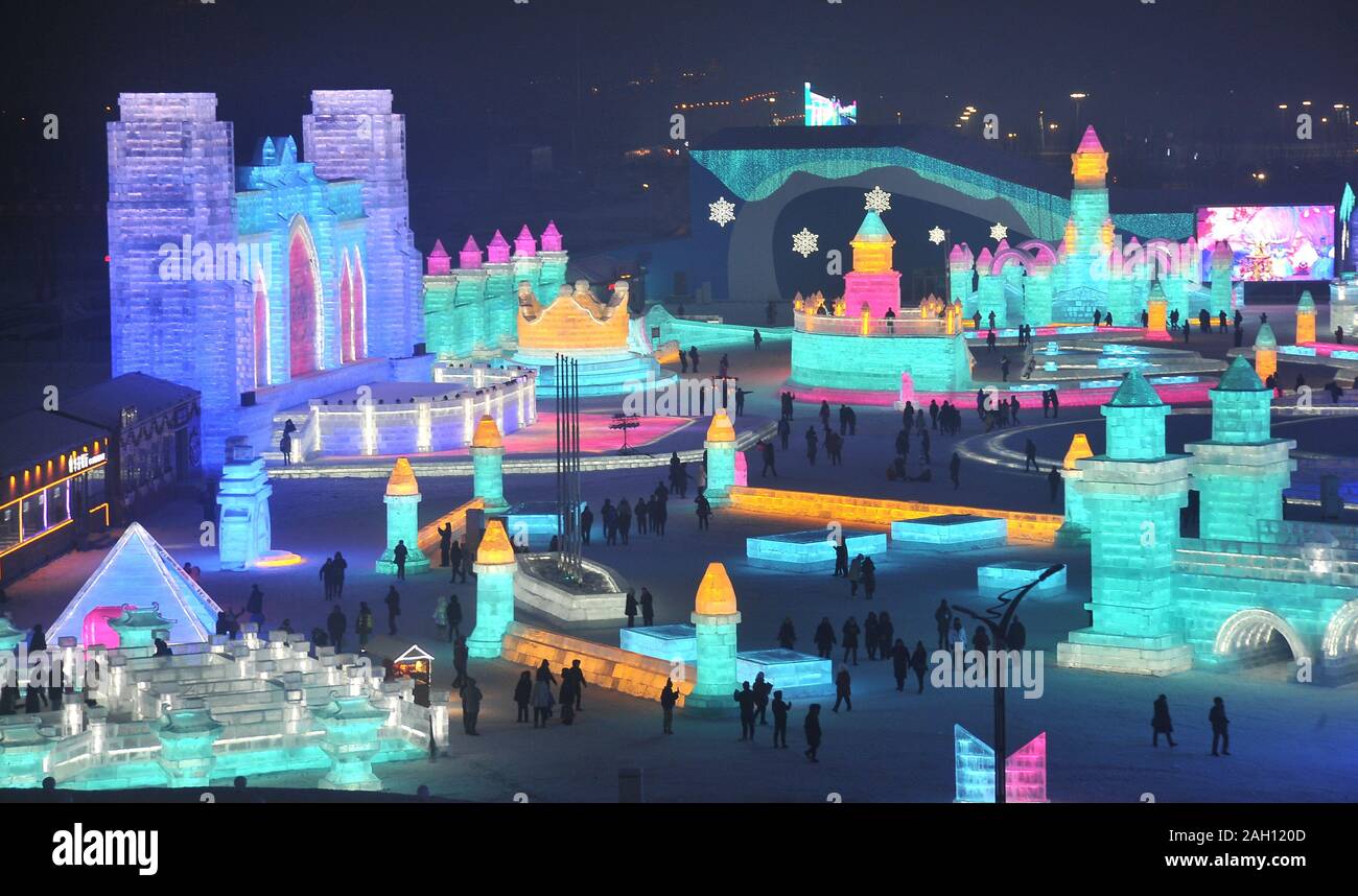 Visitors view ice sculptures on display during the 21st Harbin Ice and ...