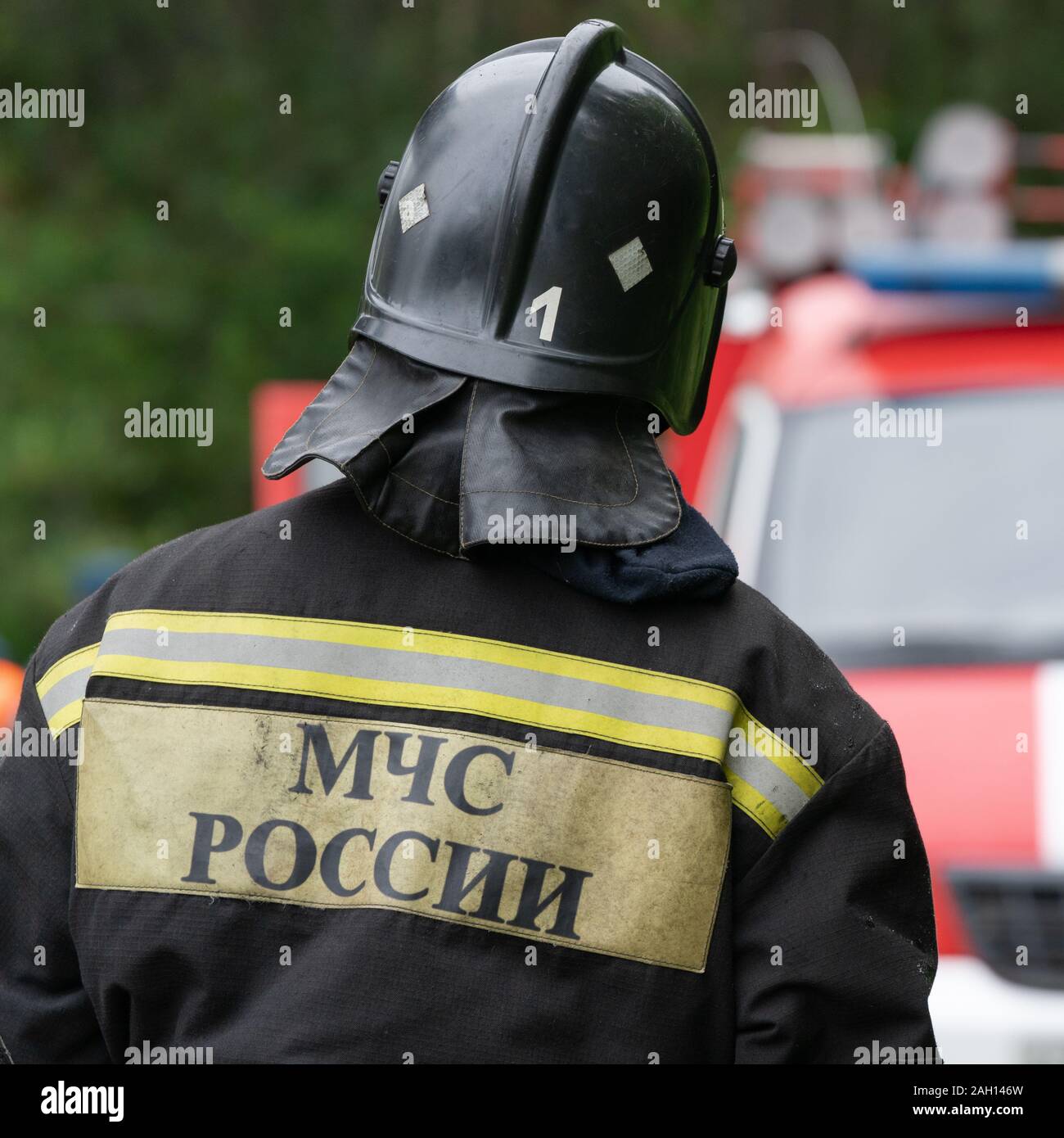 Back view with emblem Emercom of Russia on uniform rescuers of Ministry ...