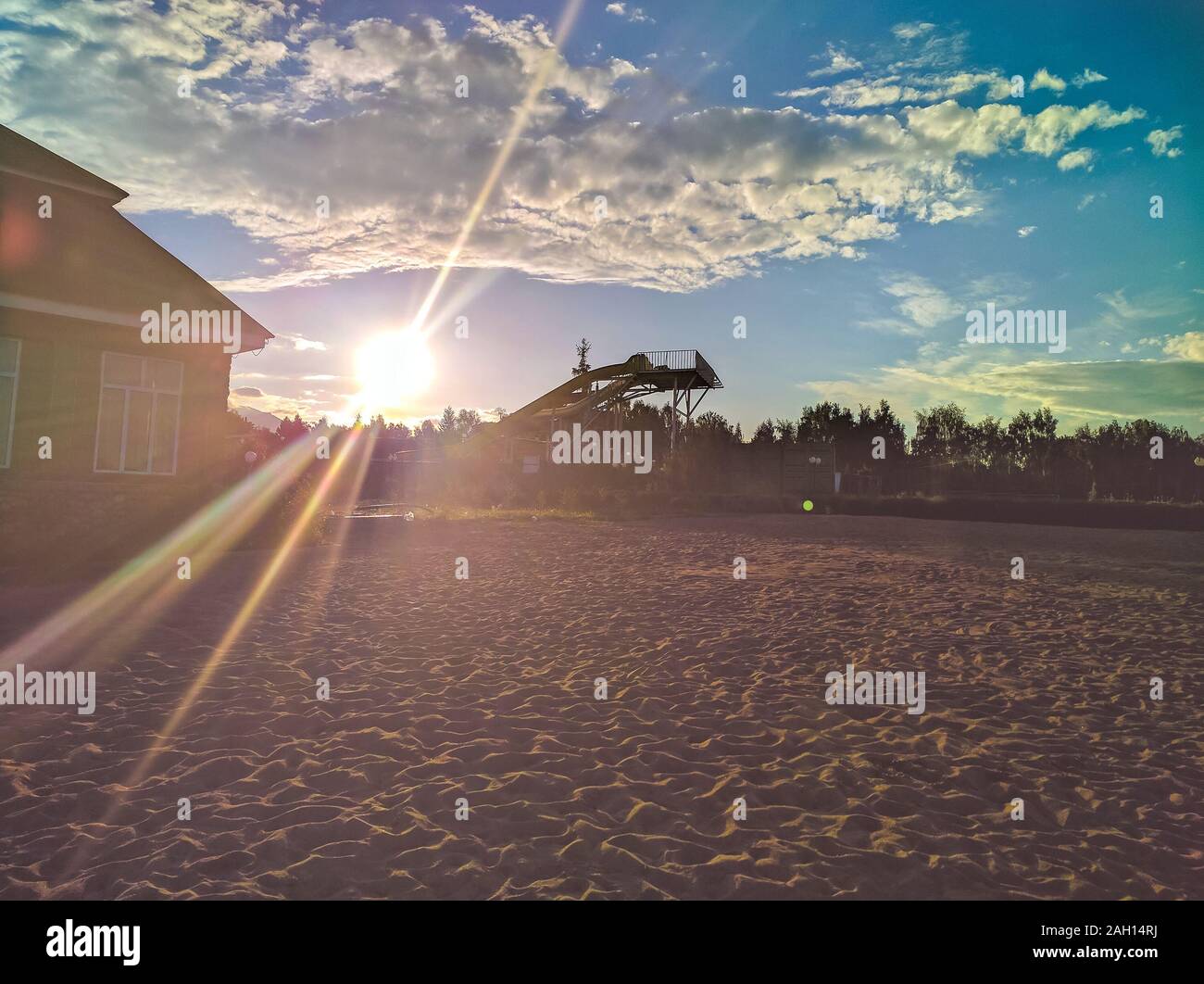 Beach cottage on sunset background Stock Photo - Alamy