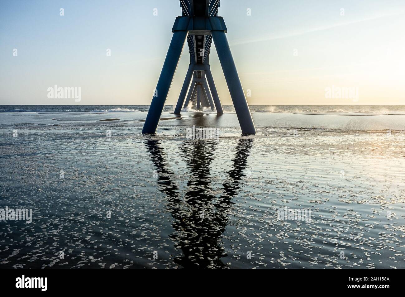 wharf for loading and unloading ships in the sunset Stock Photo - Alamy