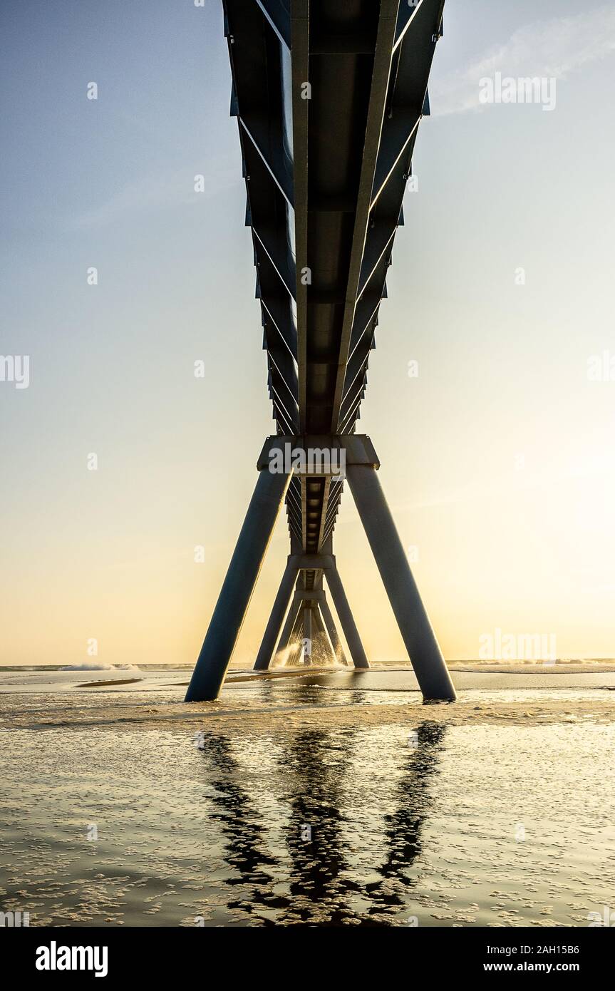 wharf for loading and unloading ships in the sunset Stock Photo - Alamy