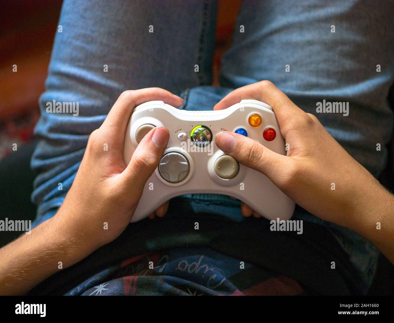 Guy plays the console Stock Photo - Alamy