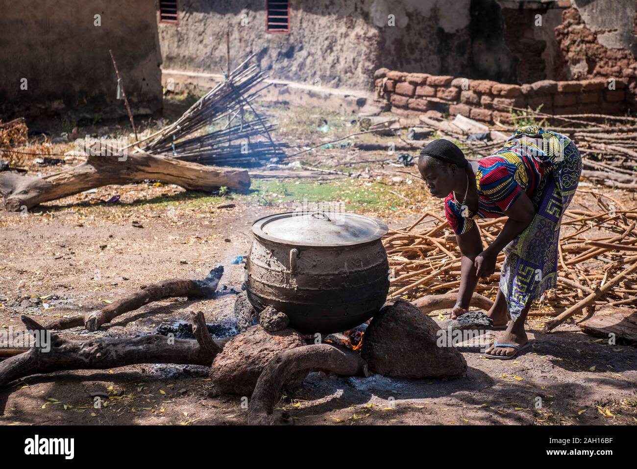 Benin, Kandi, african woman, cooking, open fire, courtyard, african ...