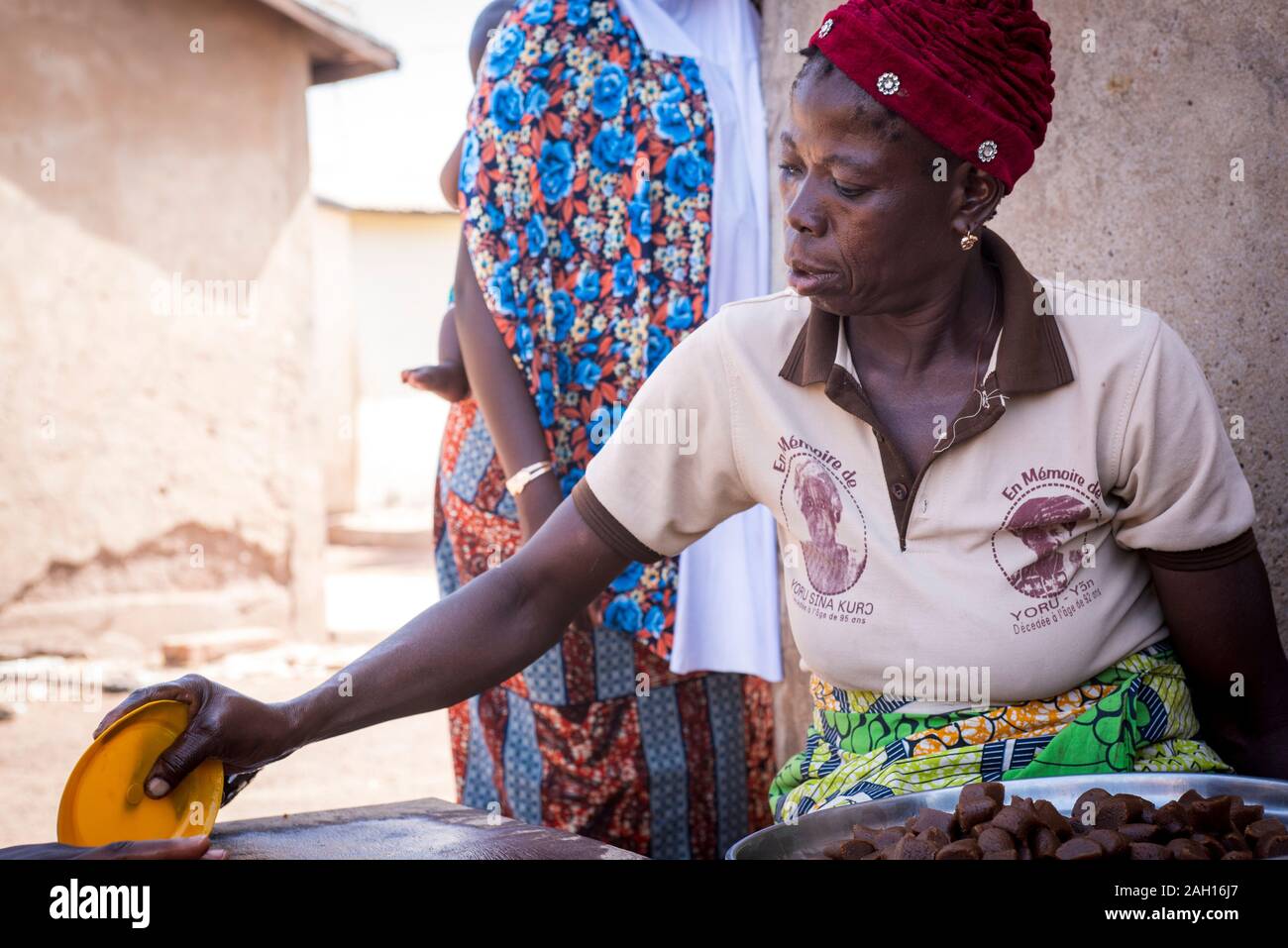 Kandi, Benin, african woman, cooking, open fire, red knit hat, african ...