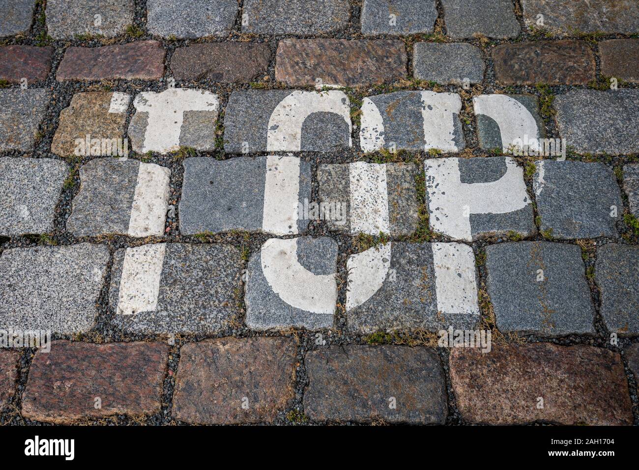the word top with white color on cobblestone for backgrounds Stock ...
