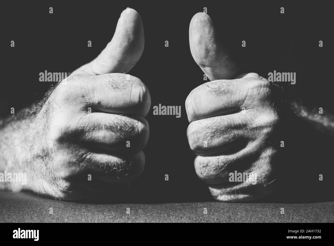 close-up of two hands showing their thumbs up Stock Photo - Alamy