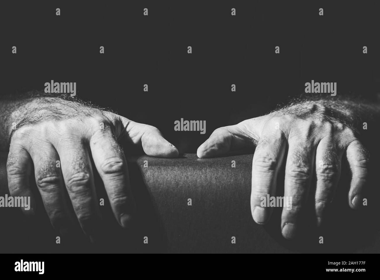 close-up of two hands holding on to something, in black and white Stock ...