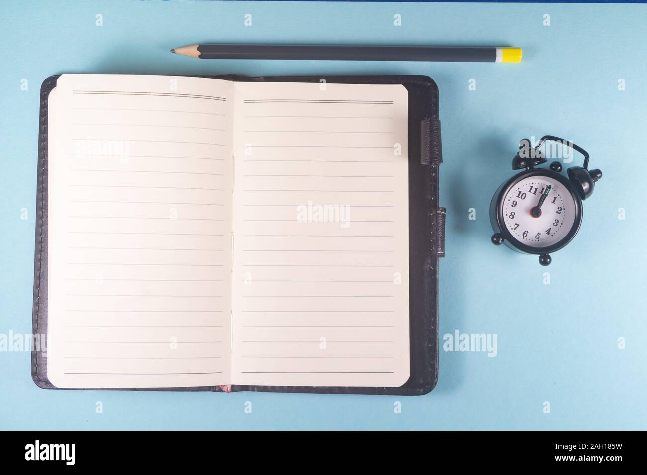 Clock and pencil hi-res stock photography and images - Alamy