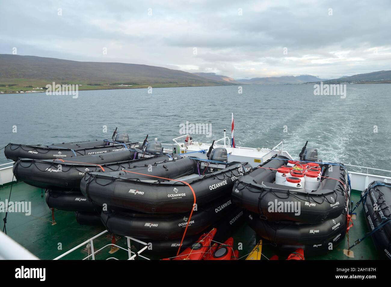 Expedition vessel MS Hondius with Zodiacs leaving the fjord of Akureyri ...