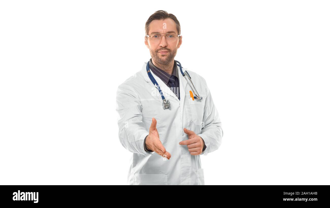 Man doctor holds out his hand to say hello. Greeting patient ...