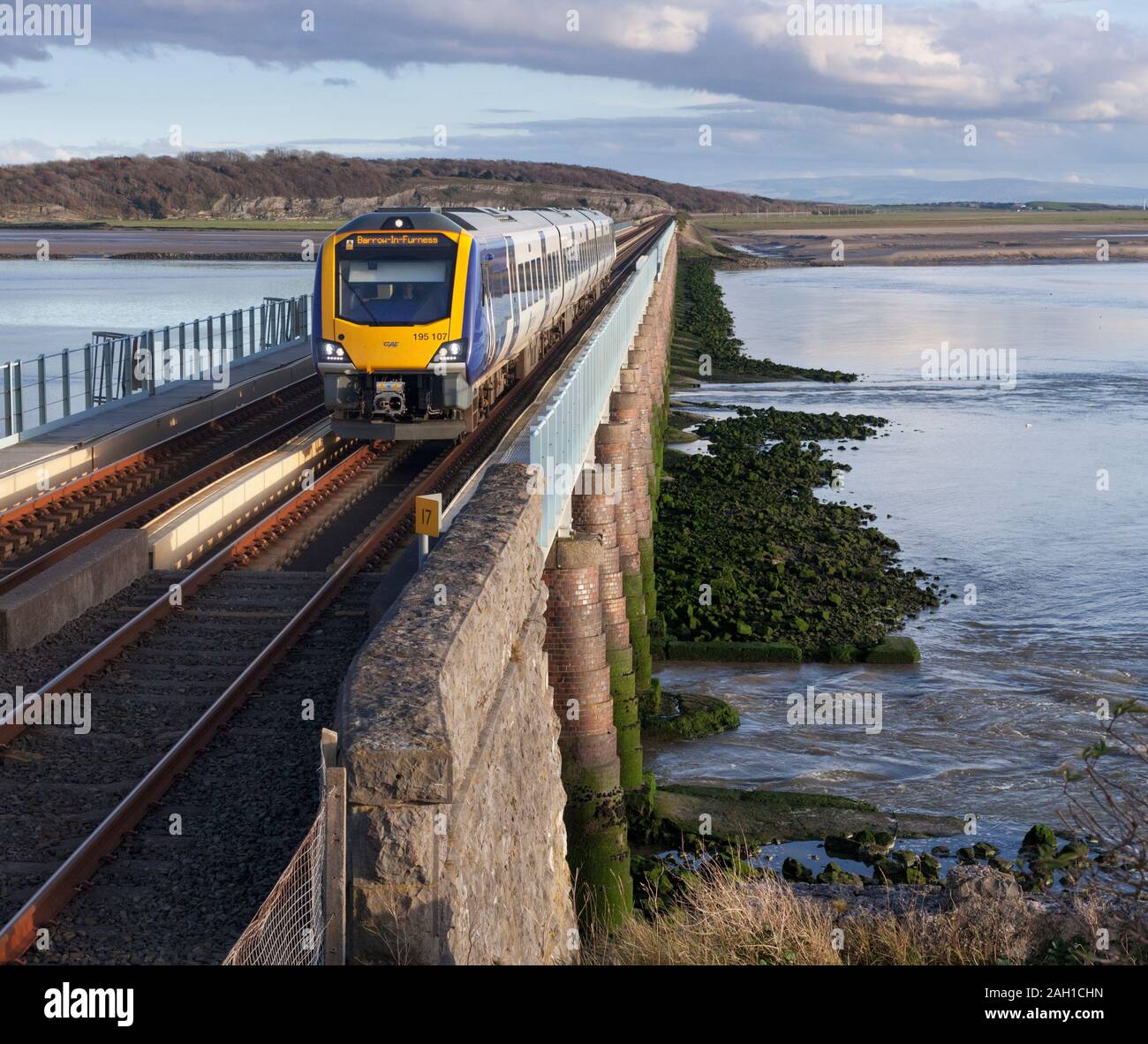Northern rail CAF class 195 train 195107 crossing Levens viaduct (river ...