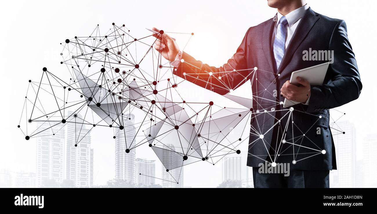 Businessman with documents pointing on abstract network with polygonal ...