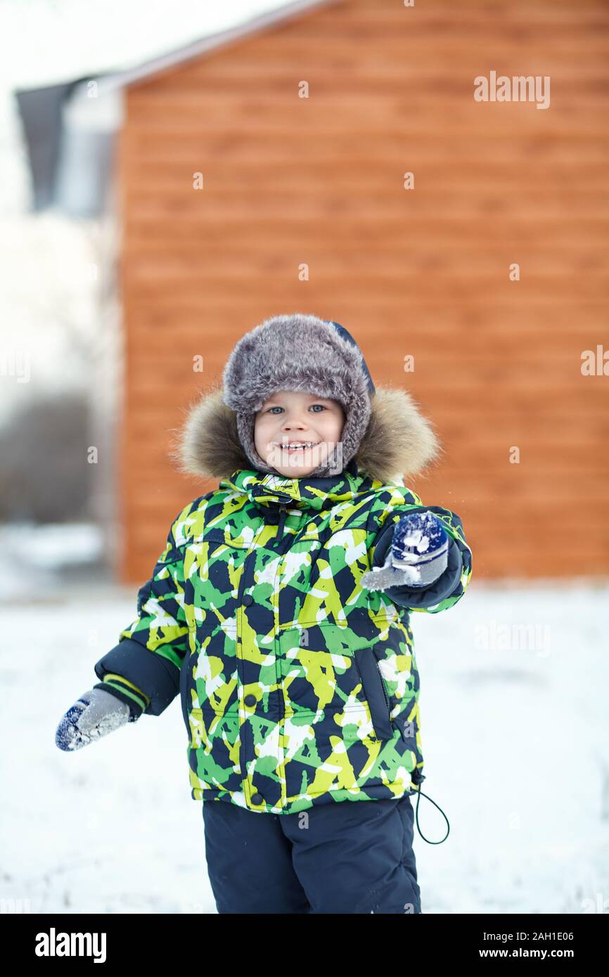 walking funny little boy in the winter. child outdoors Stock Photo - Alamy