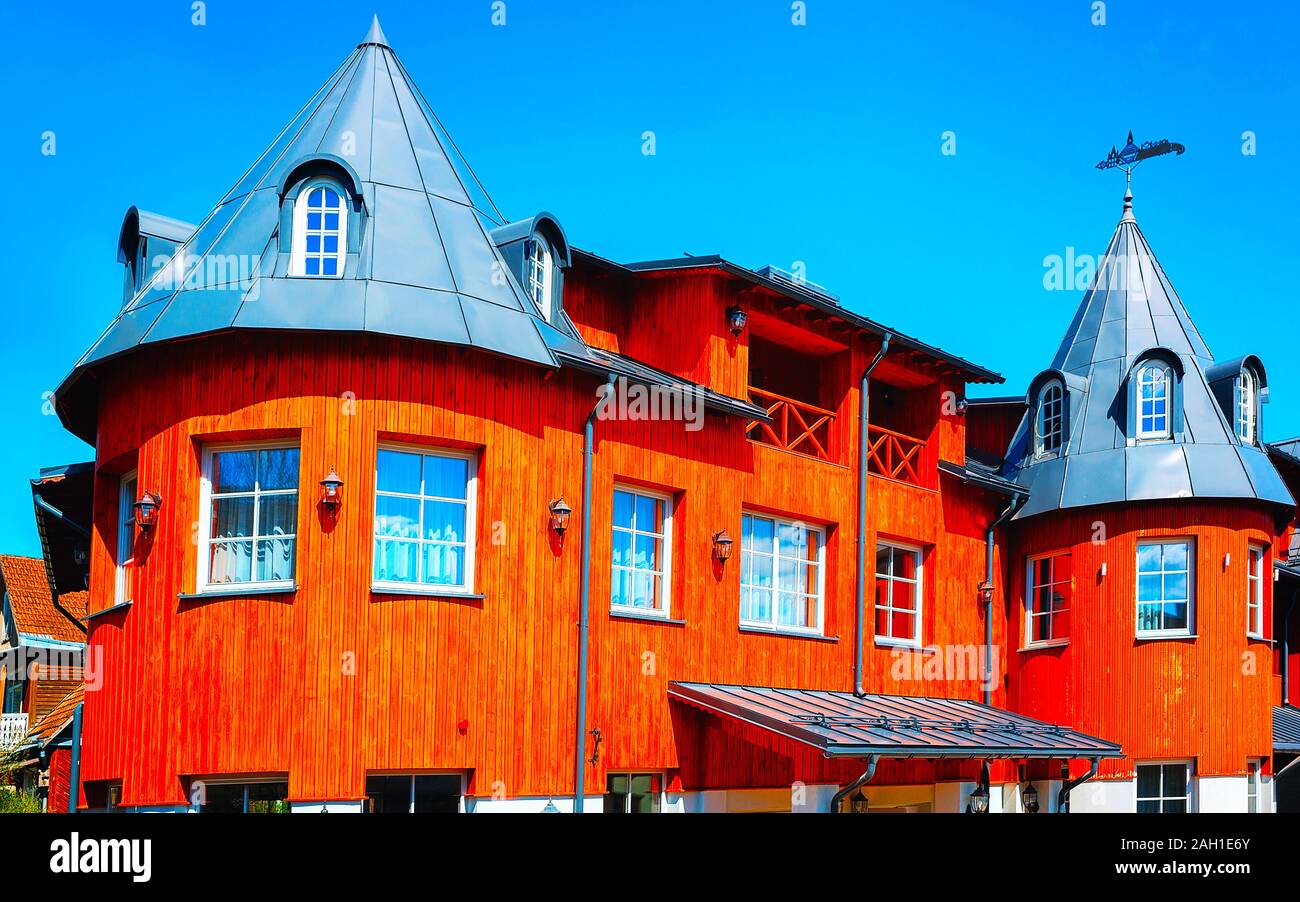 Modern red wooden country house with reflex Stock Photo - Alamy