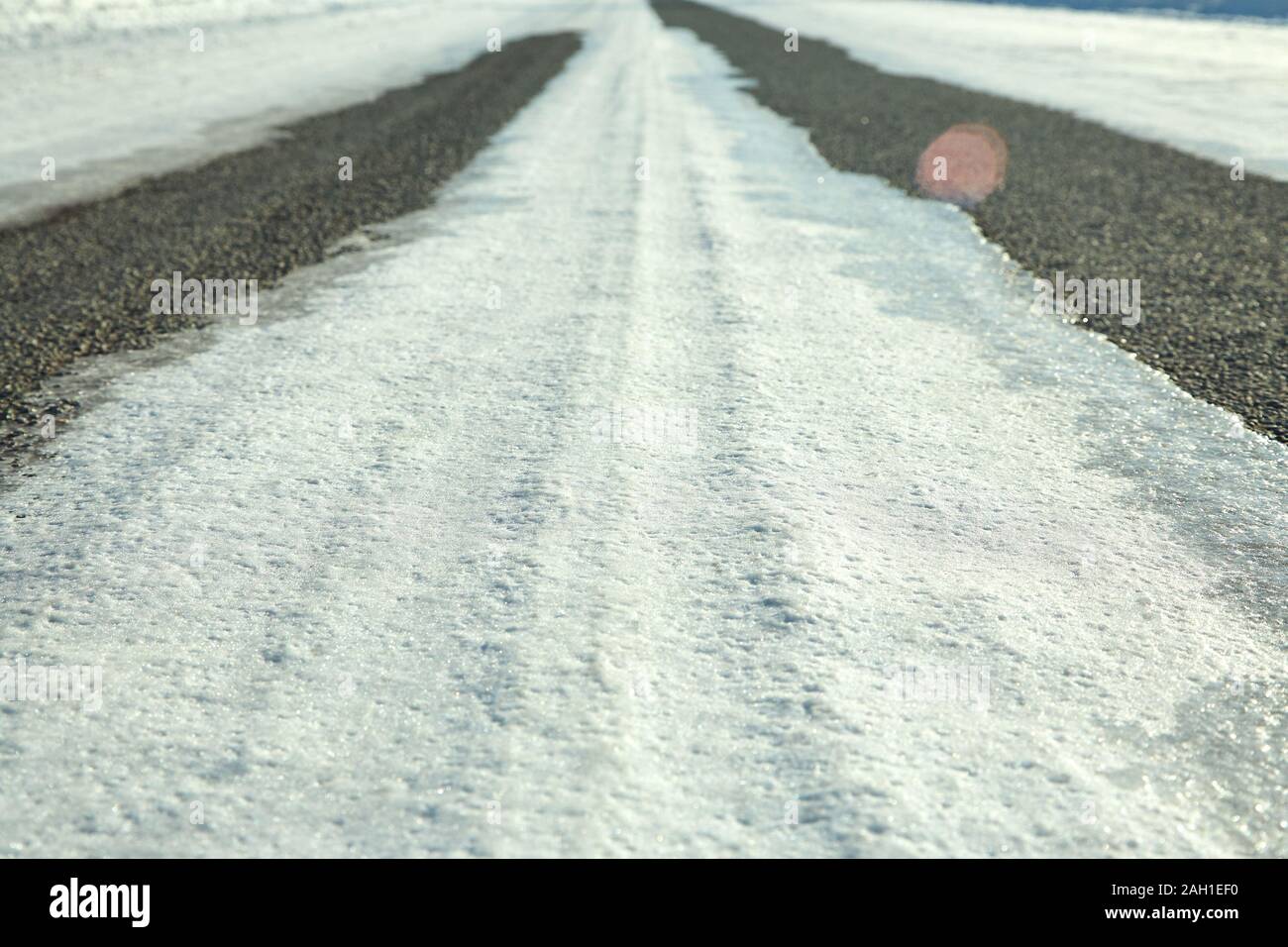 winter asphalt road covered ice crust. melted track rut Stock Photo - Alamy