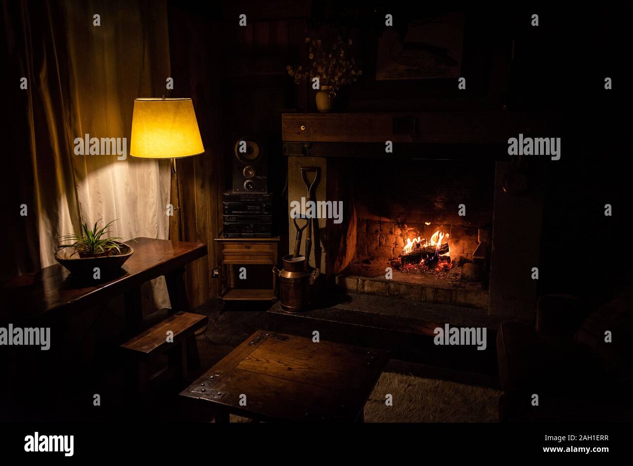 Interior of a wooden cozy and relaxing cabin with comfortable couches ...