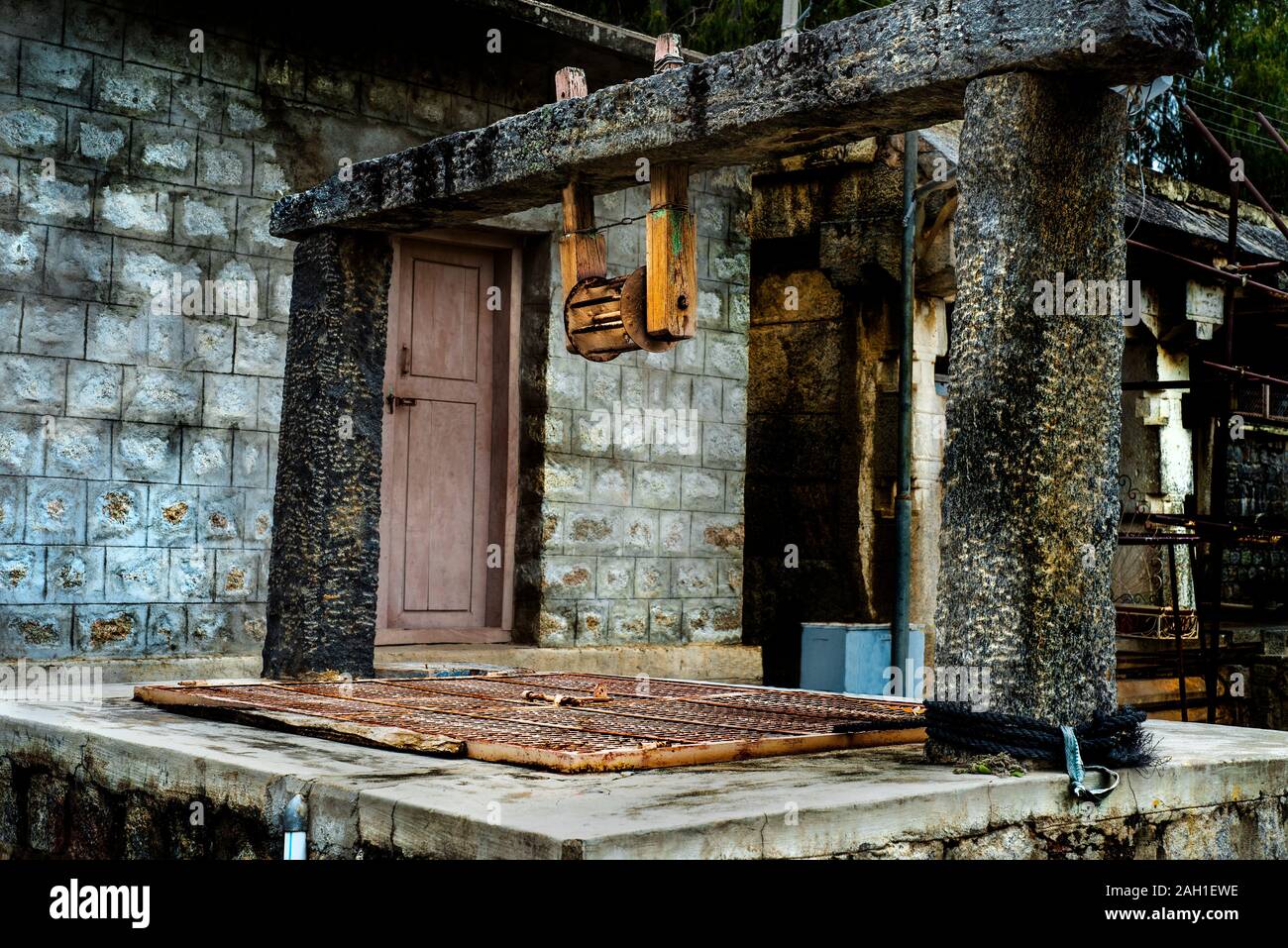 an old style well in a temple, India Stock Photo - Alamy