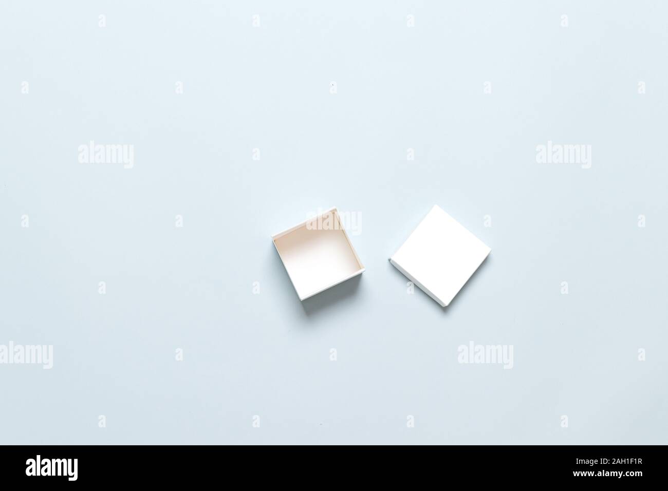 White generic box for mockup product presentation on blue background ...